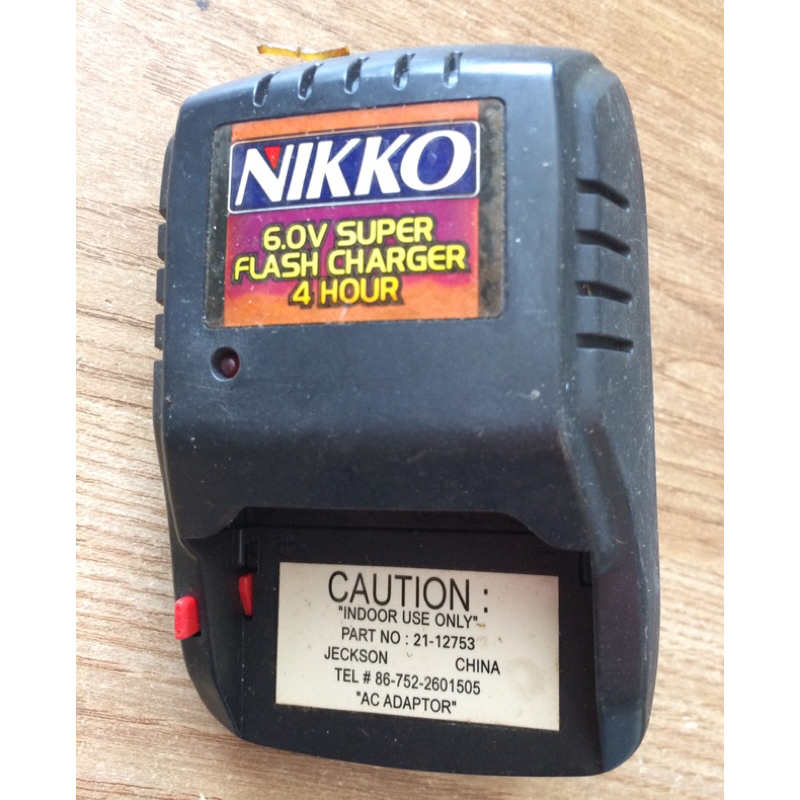 Carregador Nikko 6.0V super flash charger (não funciona) | Shopee Brasil