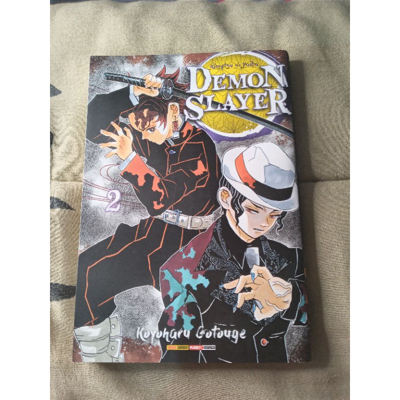 Magá Demon Slayer/Kimetsu no yaiba volume 2. O mangá é usado, porém ...
