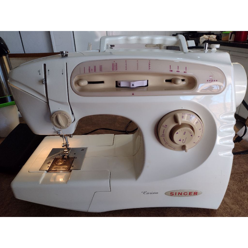Maquina de costura SINGER Carina portatil | Shopee Brasil