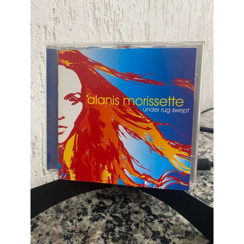 CD Alanis Morissette - Under Rug Swept | Shopee Brasil