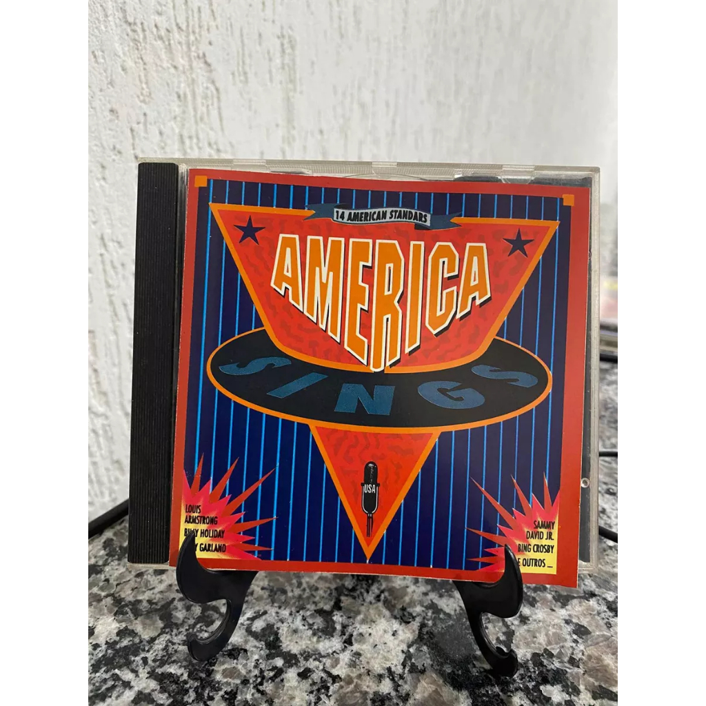 Cd América Sings - Coletânea Internacional | Shopee Brasil